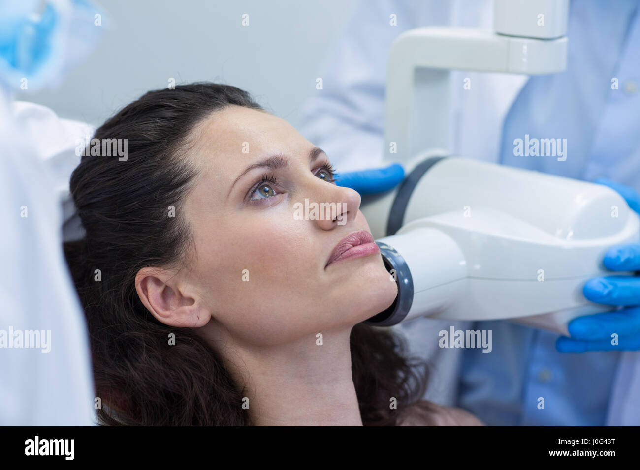 Dentist taking x-ray of patients teeth at dental clinic Stock Photo - Alamy