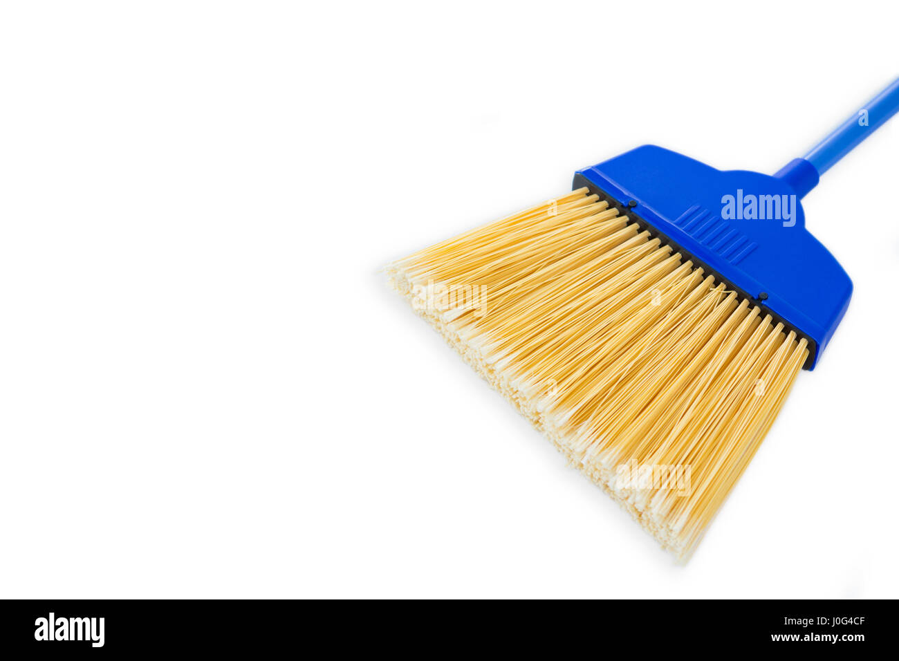 Close-up of blue broom against white background Stock Photo - Alamy