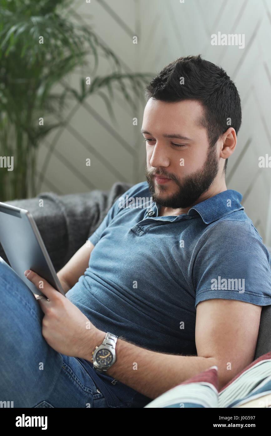 Lifestyle. Handsome man at home Stock Photo - Alamy