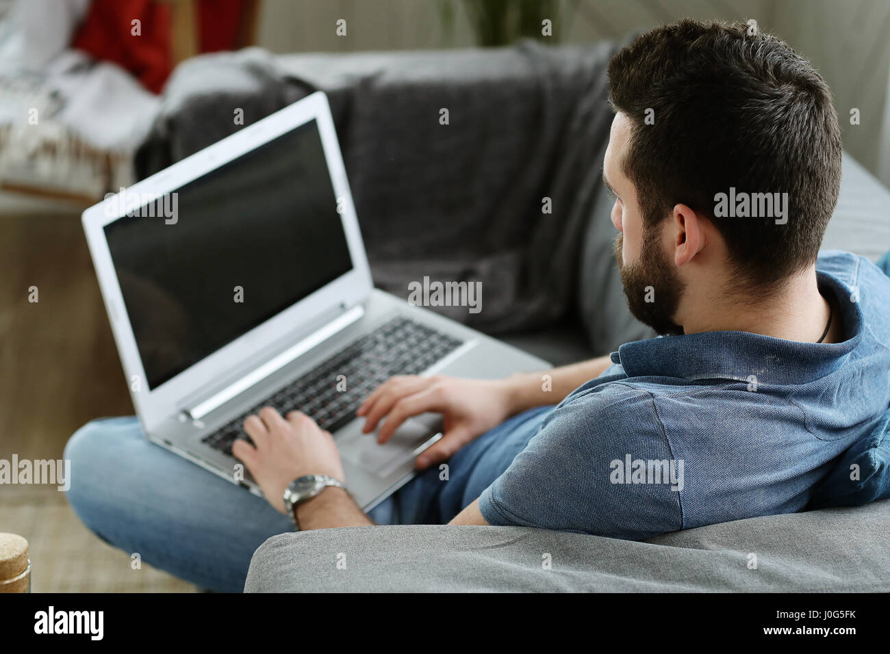 Lifestyle. Handsome man with laptop Stock Photo - Alamy