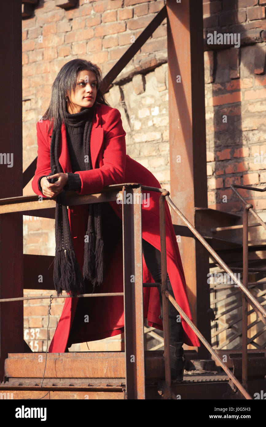 Woman in red coat Stock Photo - Alamy