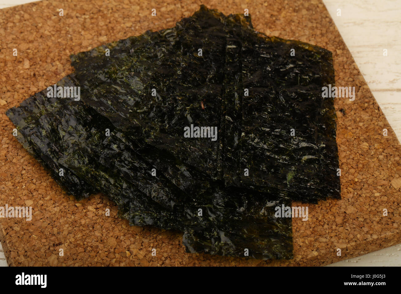 Crispy Nori sheets chips over wooden background Stock Photo - Alamy