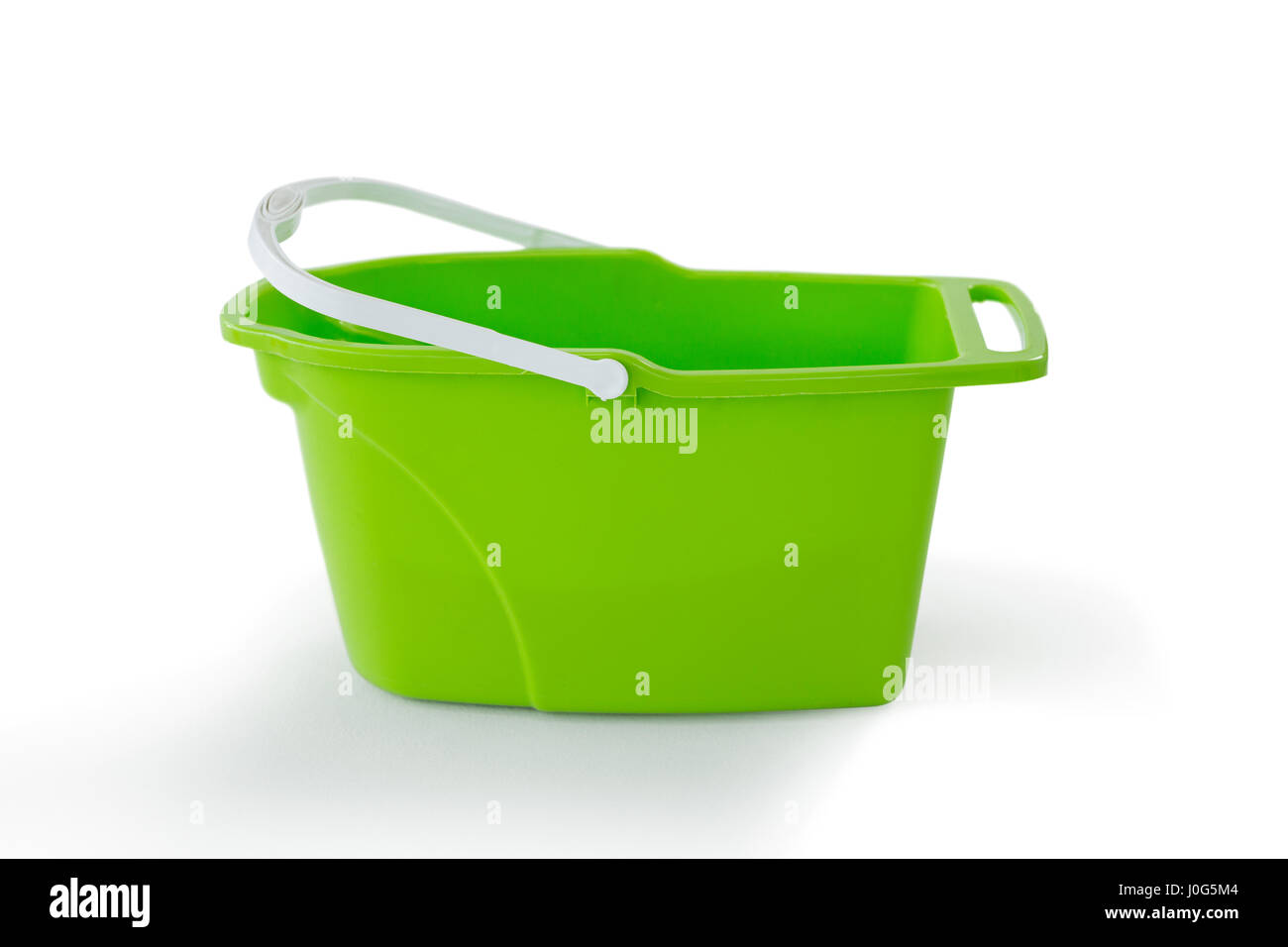 Close-up of green bucket against white background Stock Photo - Alamy