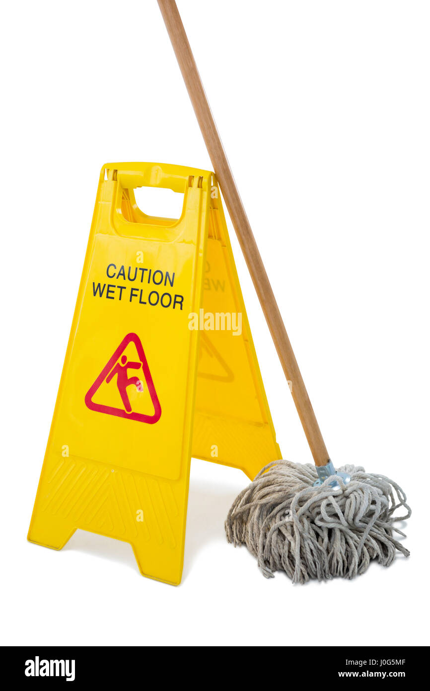 Close up of wet floor sigh board with mop against white background ...