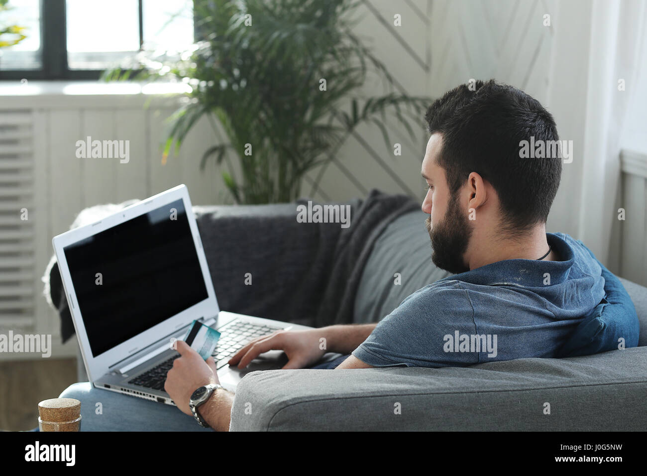 Lifestyle. Handsome man with laptop Stock Photo - Alamy