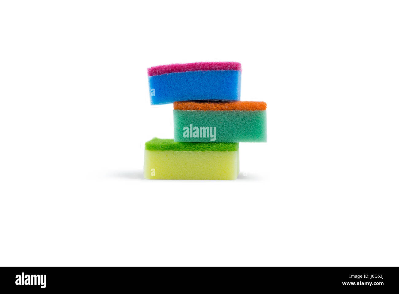 Stack of colorful sponge against white background Stock Photo - Alamy