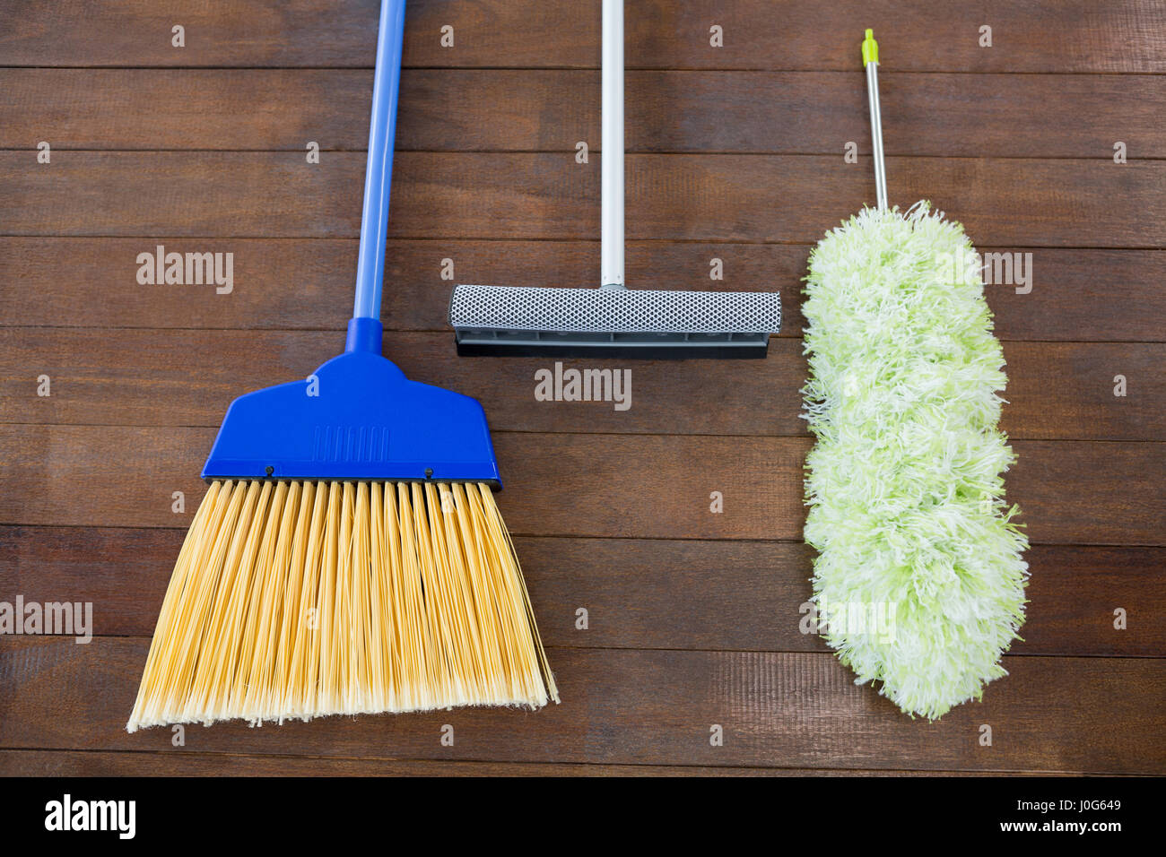 Overhead view of cleaning hand tools on wooden table Stock Photo - Alamy
