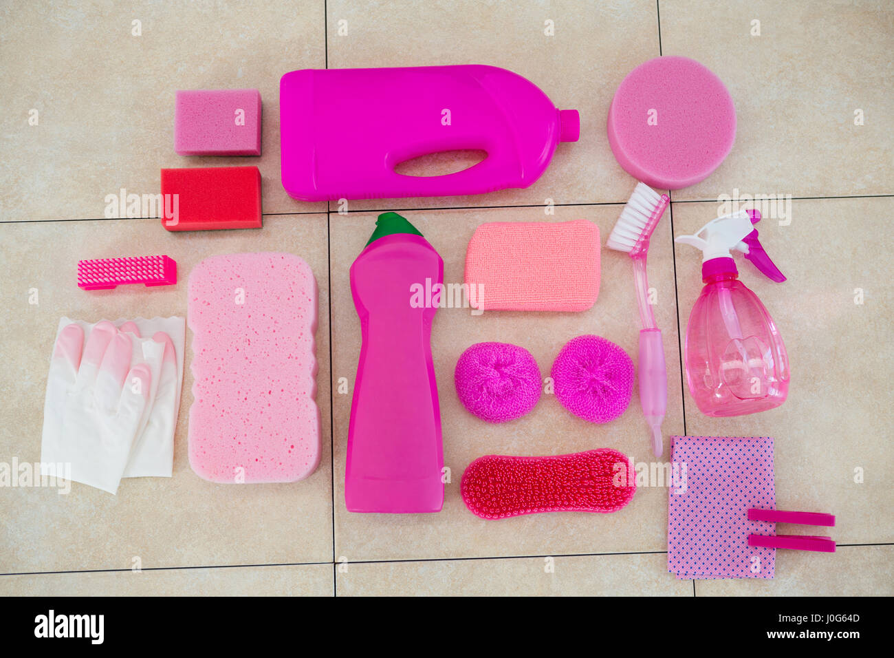 Overhead view of pink color cleaning equipment on tiled floor Stock ...