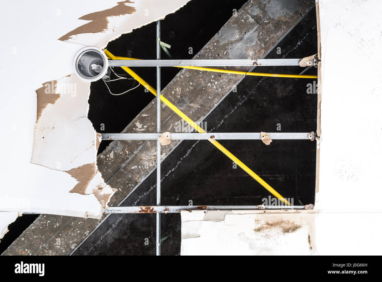 Damaged Ceiling with Lamp Electrical Pipe and Metal Structure Stock ...