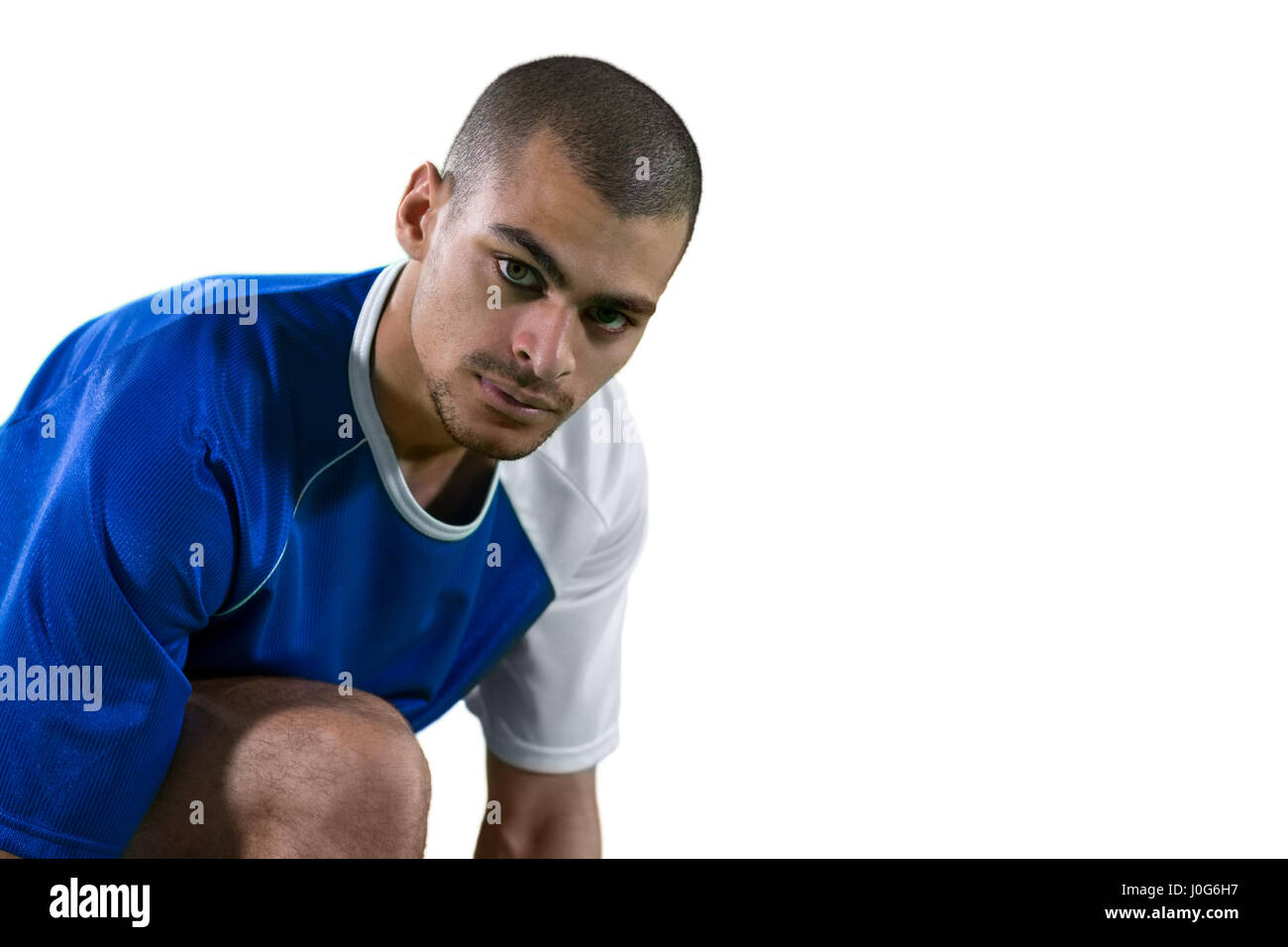 Portrait of football player getting ready for the game against white ...