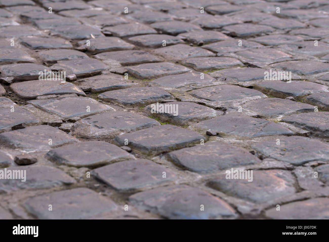 Close-up cobblestone pavement, stone street pavement background with ...