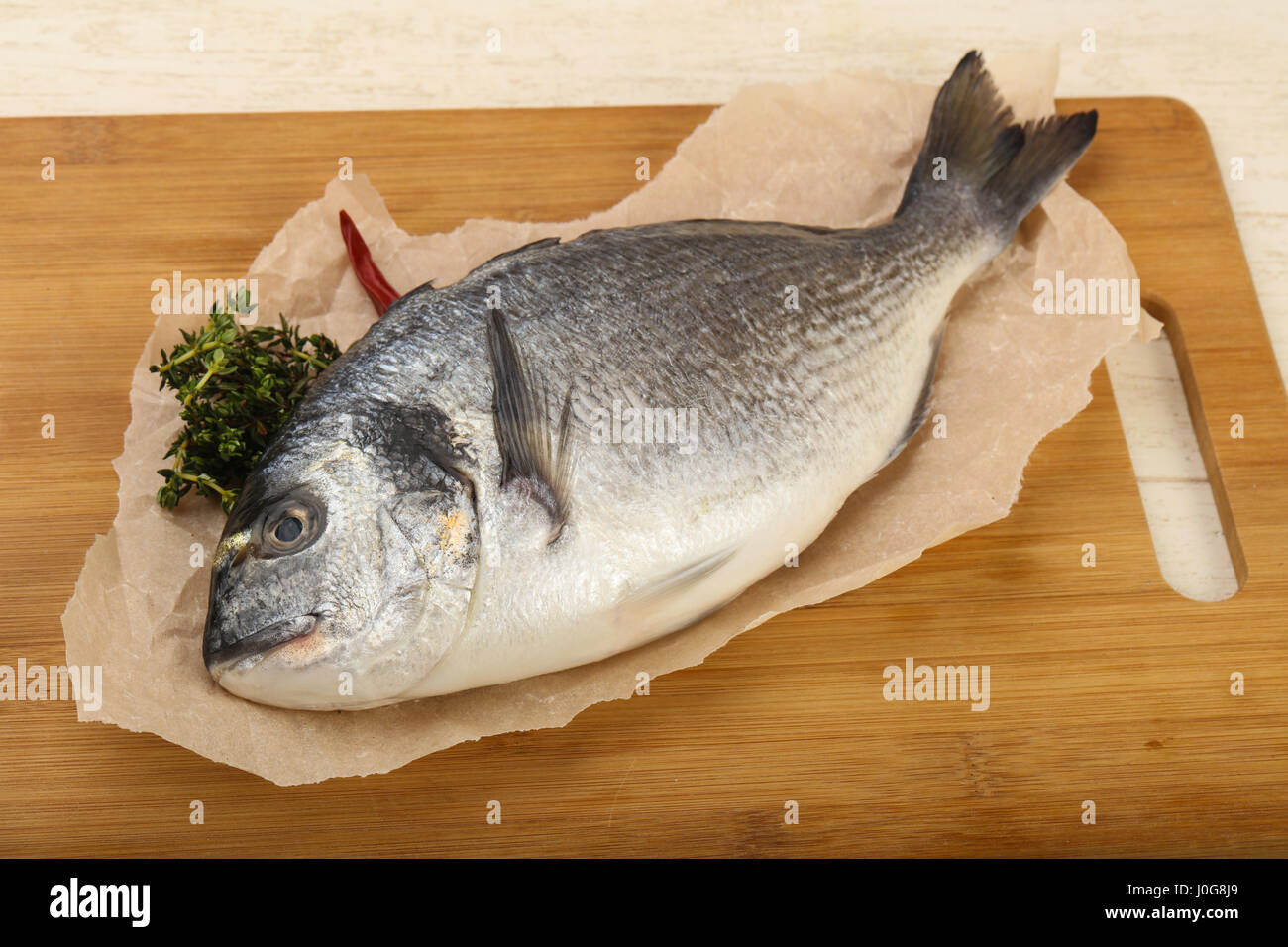 raw dorada fish - ready for cooking Stock Photo - Alamy
