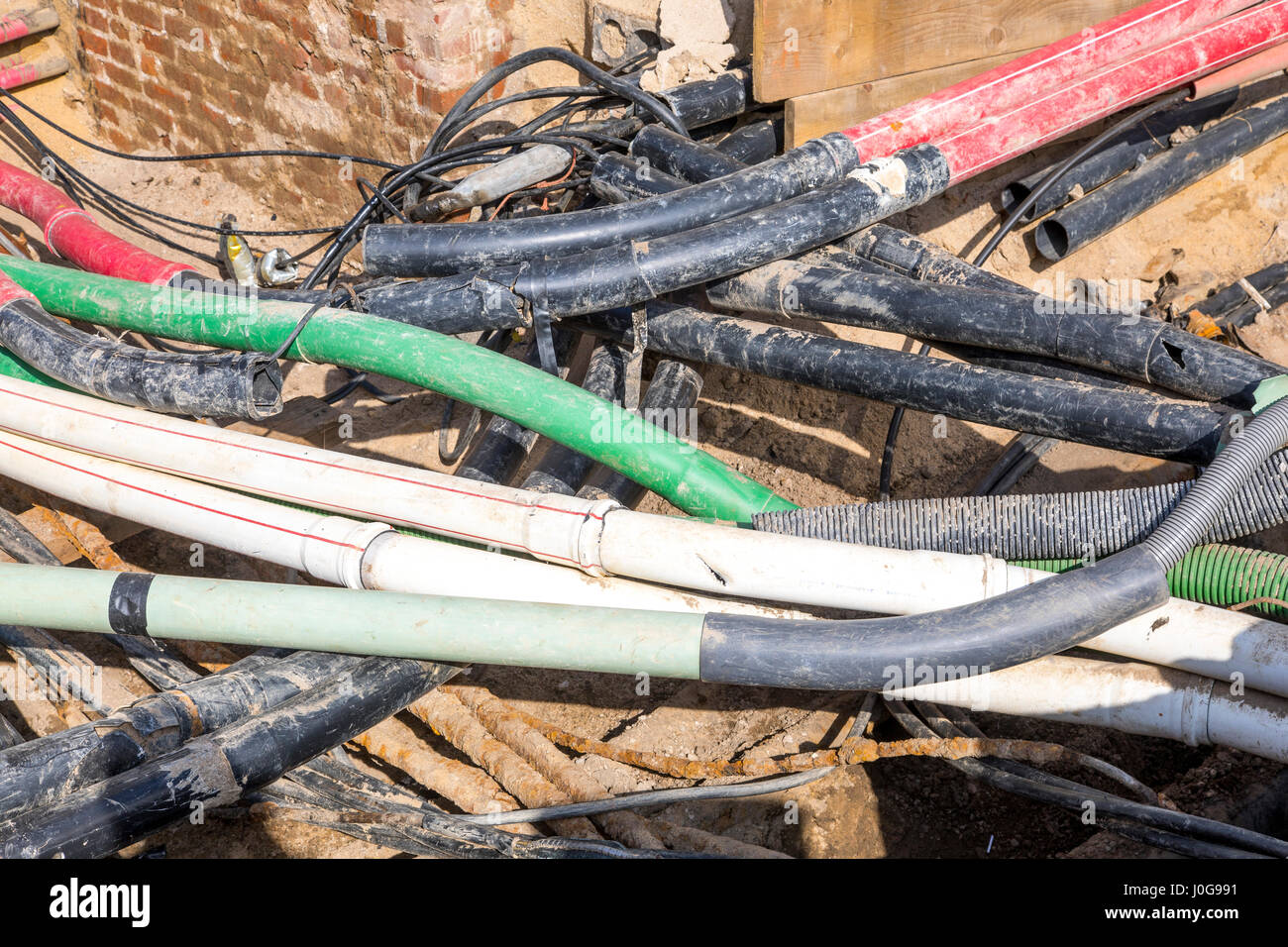 Cables, pipelines, tangle in a construction site, supply lines cleared ...
