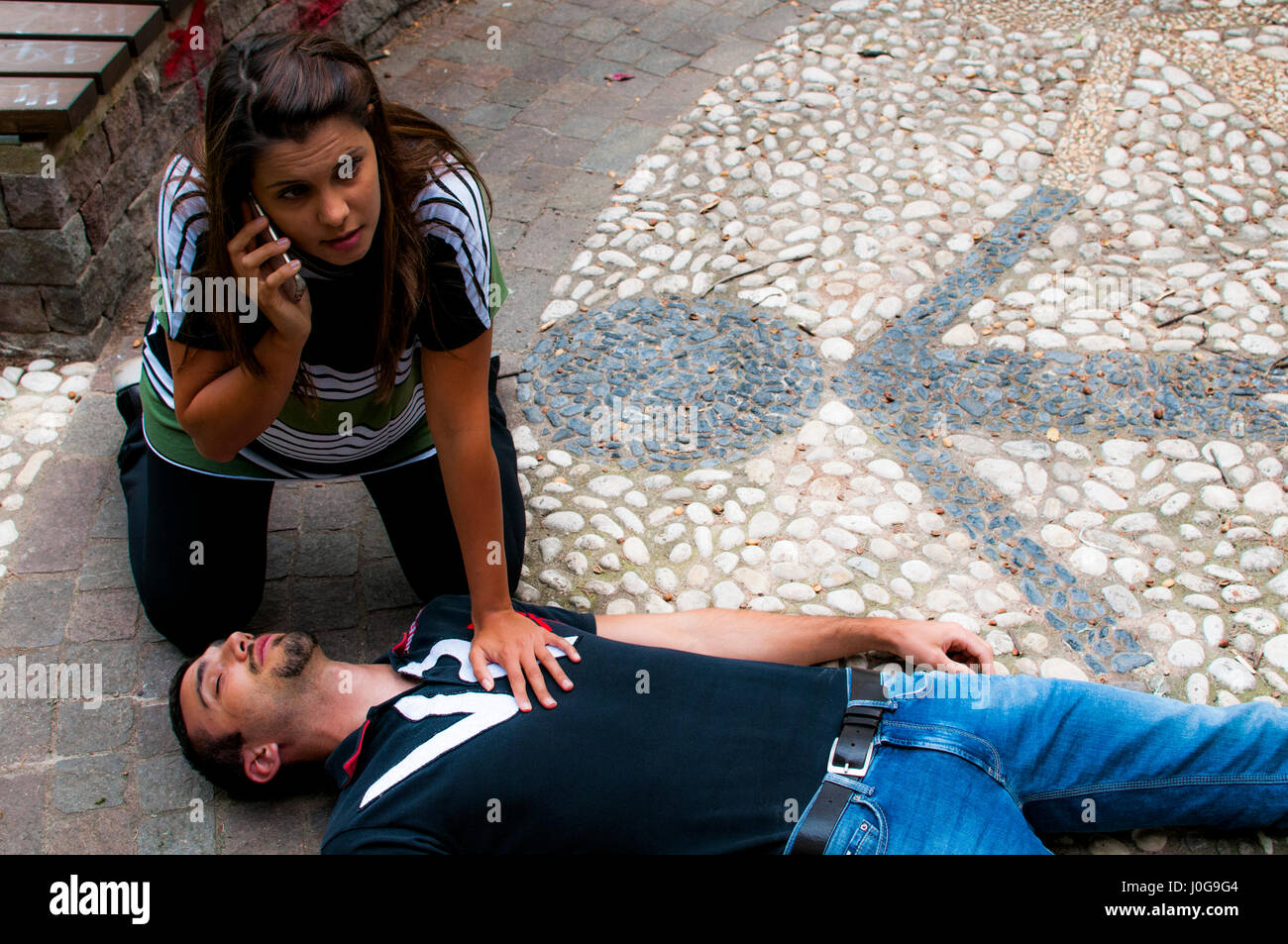 young girl helping a guy after heart attack with cardiopulmonary ...