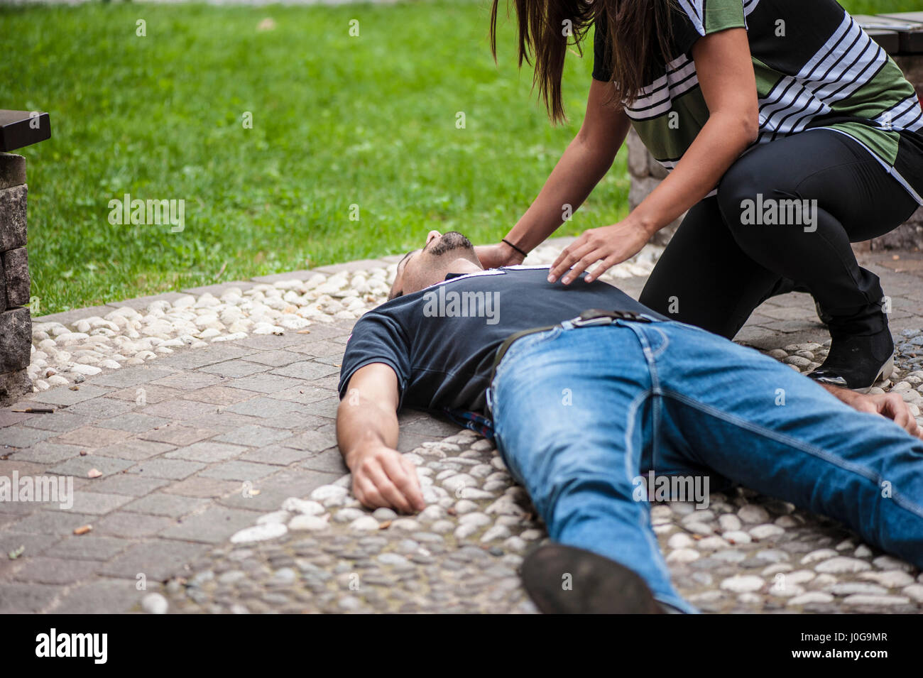 young girl helping a guy after heart attack with cardiopulmonary ...