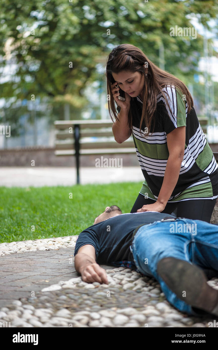 young girl helping a guy after heart attack with cardiopulmonary ...