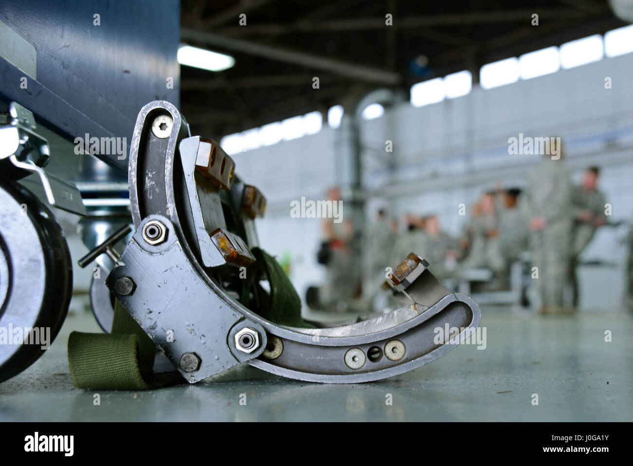 A one-step loading adapter lies on a hangar floor at Shaw Air Force ...