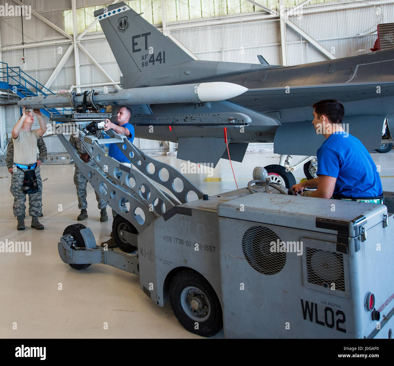 The 96th Aircraft Maintenance Squadron Blue team loads an AIM-120 ...