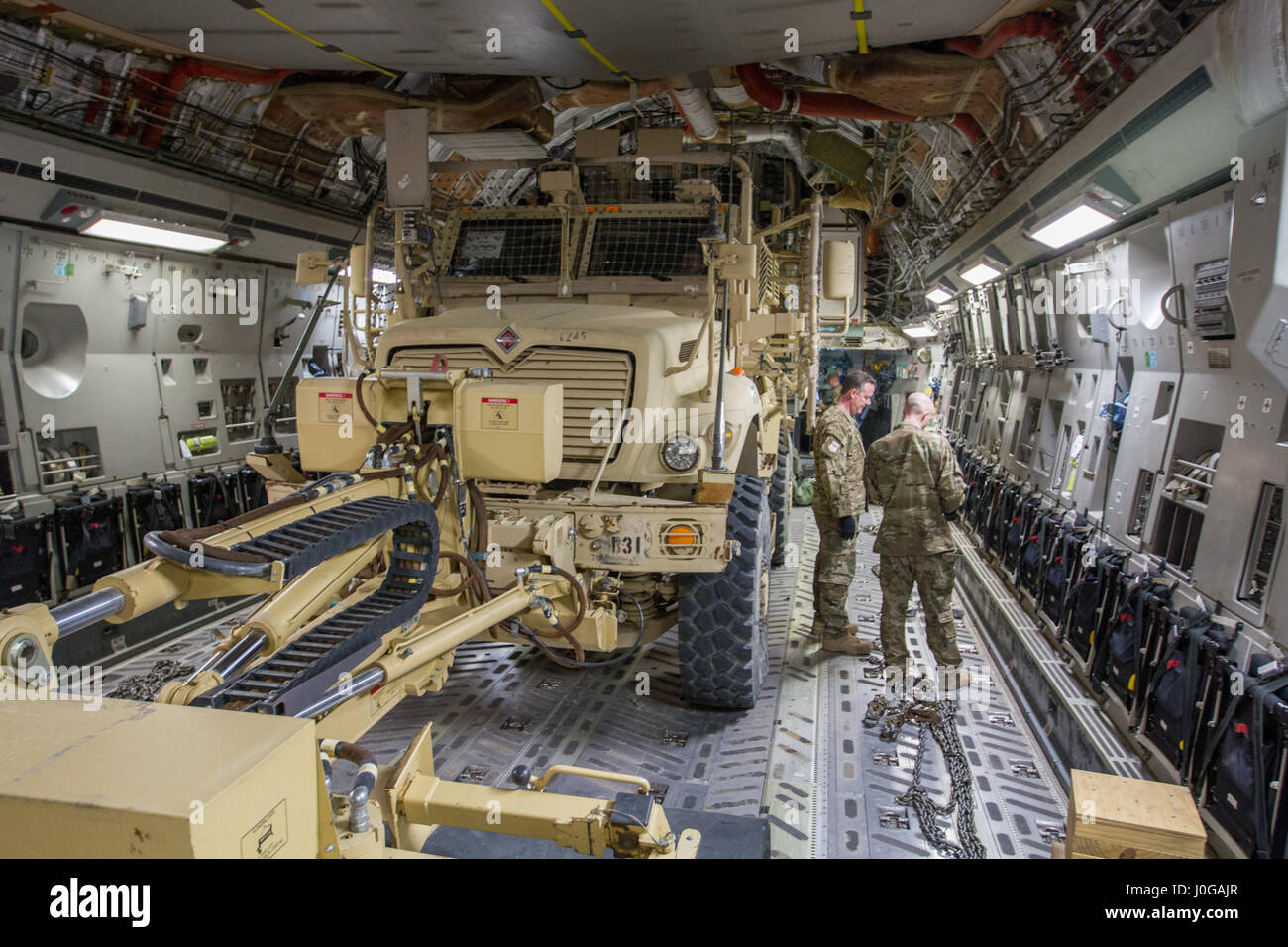 Charlie Company, 1st Battalion 187th Infantry Regiment load a mine ...