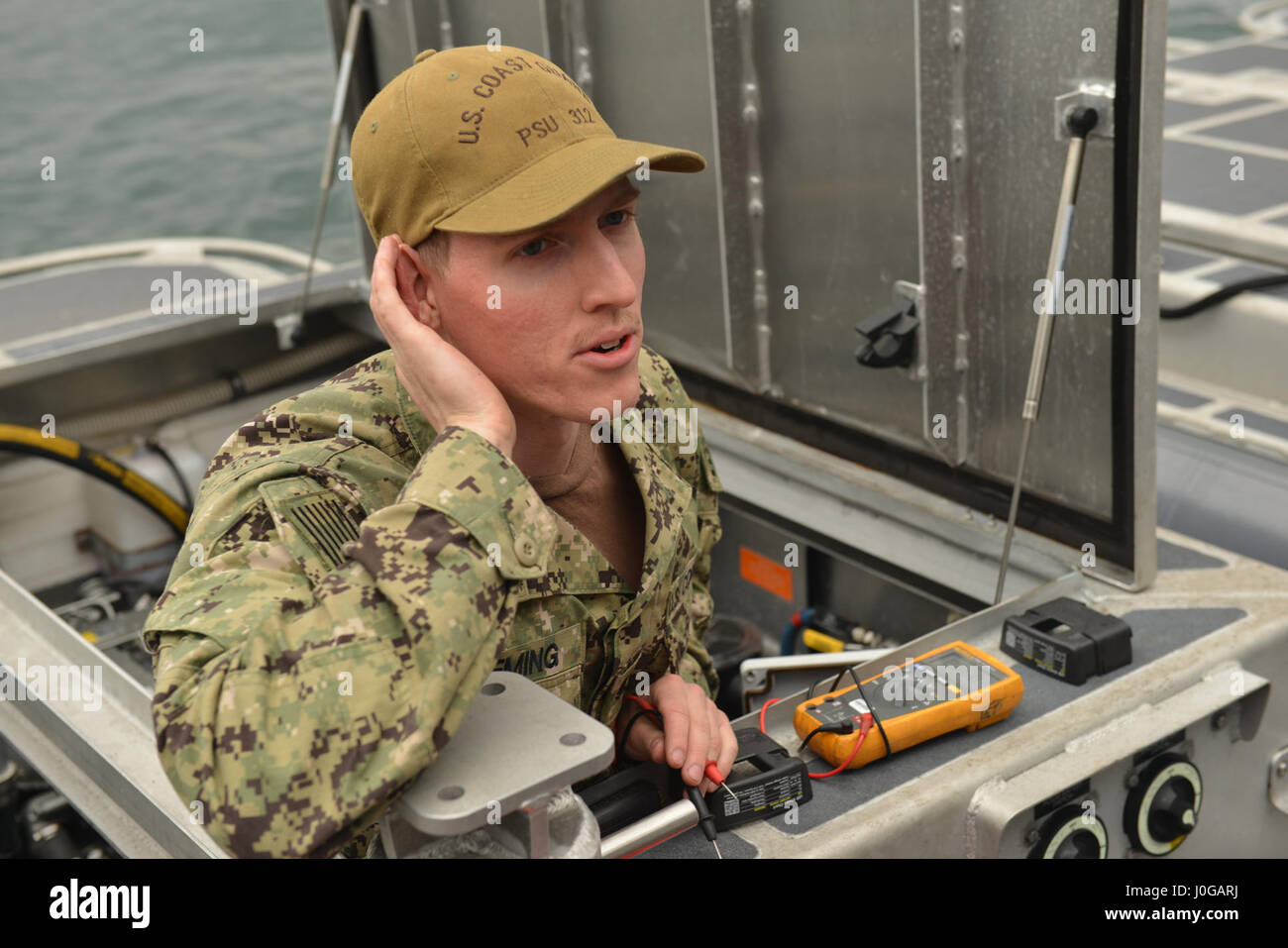 U.S. Coast Guard Petty Officer 2nd Class Michael Fleming, a an ...