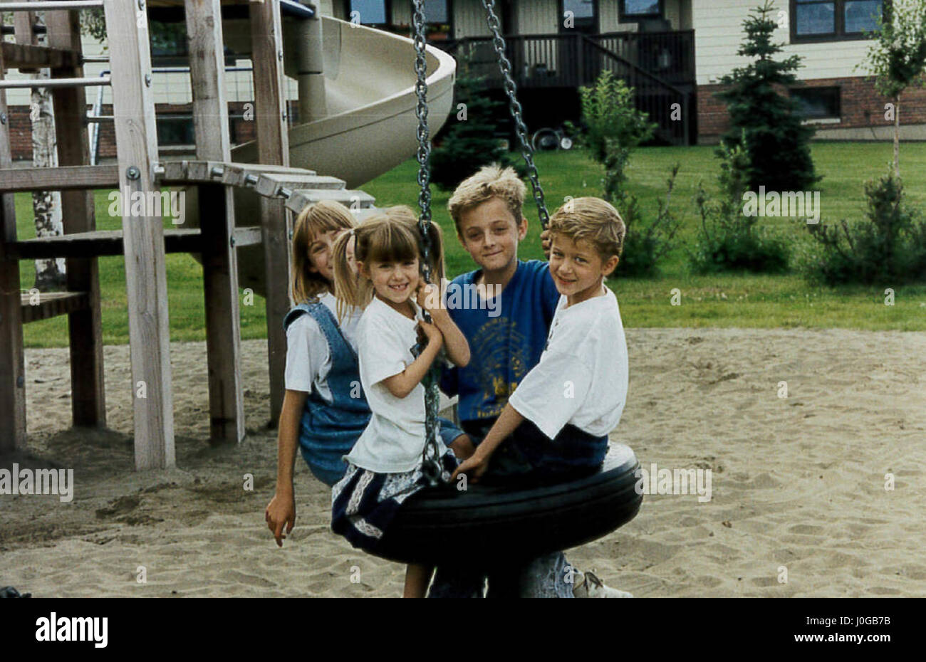 Stacy, Amanda, Wes and Calvin Wright pose for a photo on a playground ...