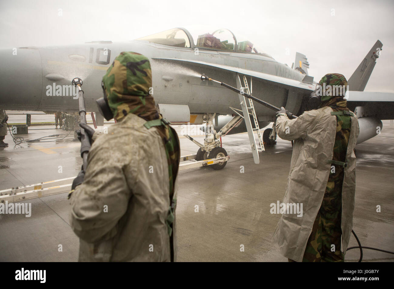 U.S. Marines conduct aircraft decontamination with Marine Fighter ...