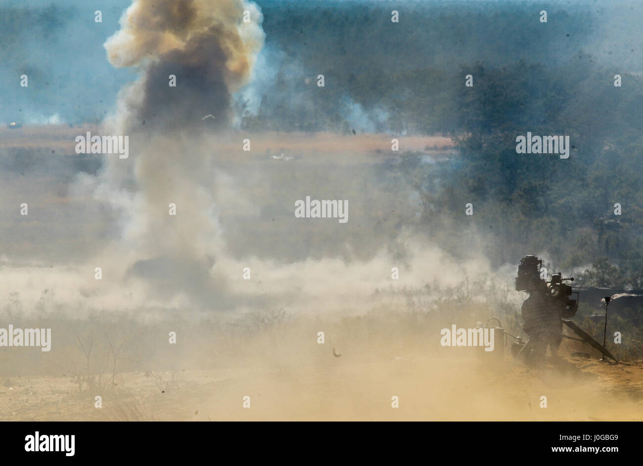 A BGM-71 TOW 2B Aero explodes hitting a tank target after being fired ...