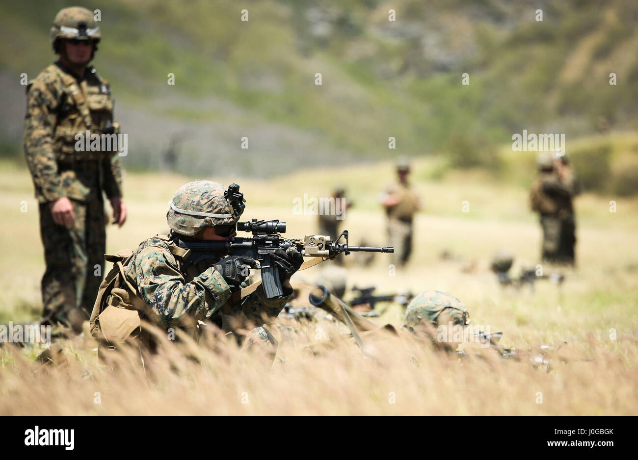 A Marine mortarman conducts a fire-and-maneuver exercise during the ...