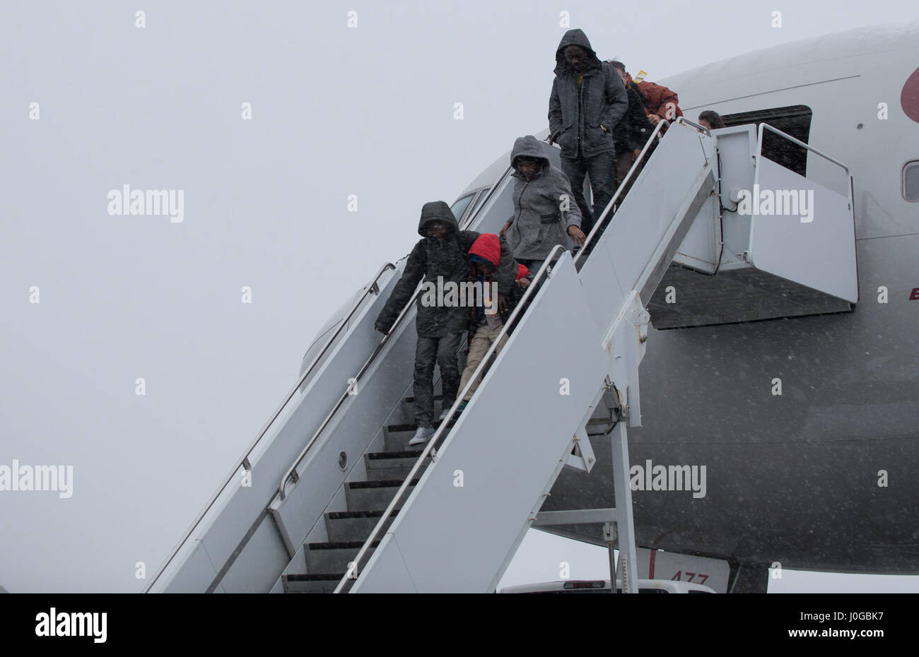 U.S. Air Force Airmen and families exit from the rotator at Misawa Air ...