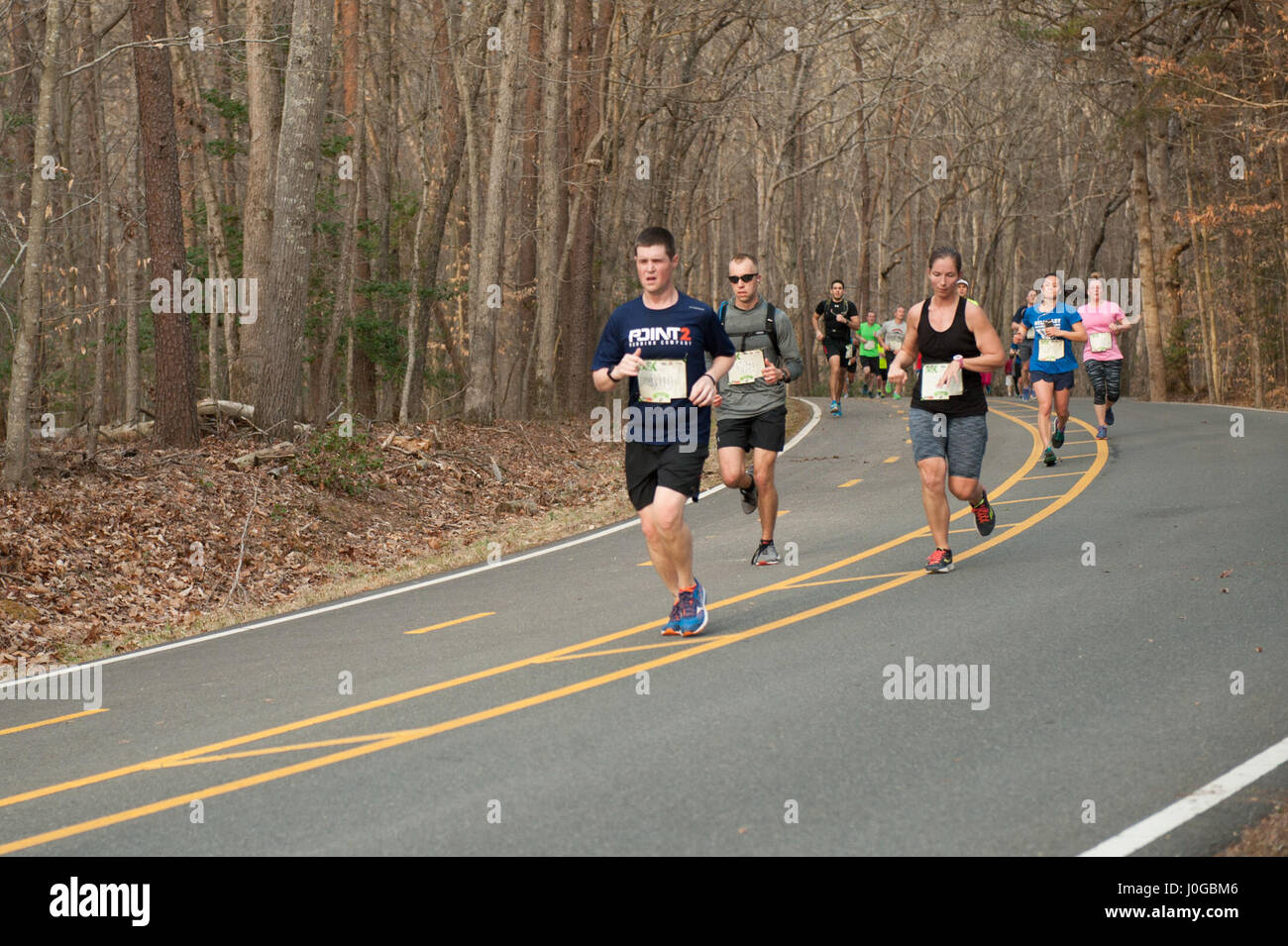 Participants of the Marine Corps Marathon (MCM) 17.75K run the course ...
