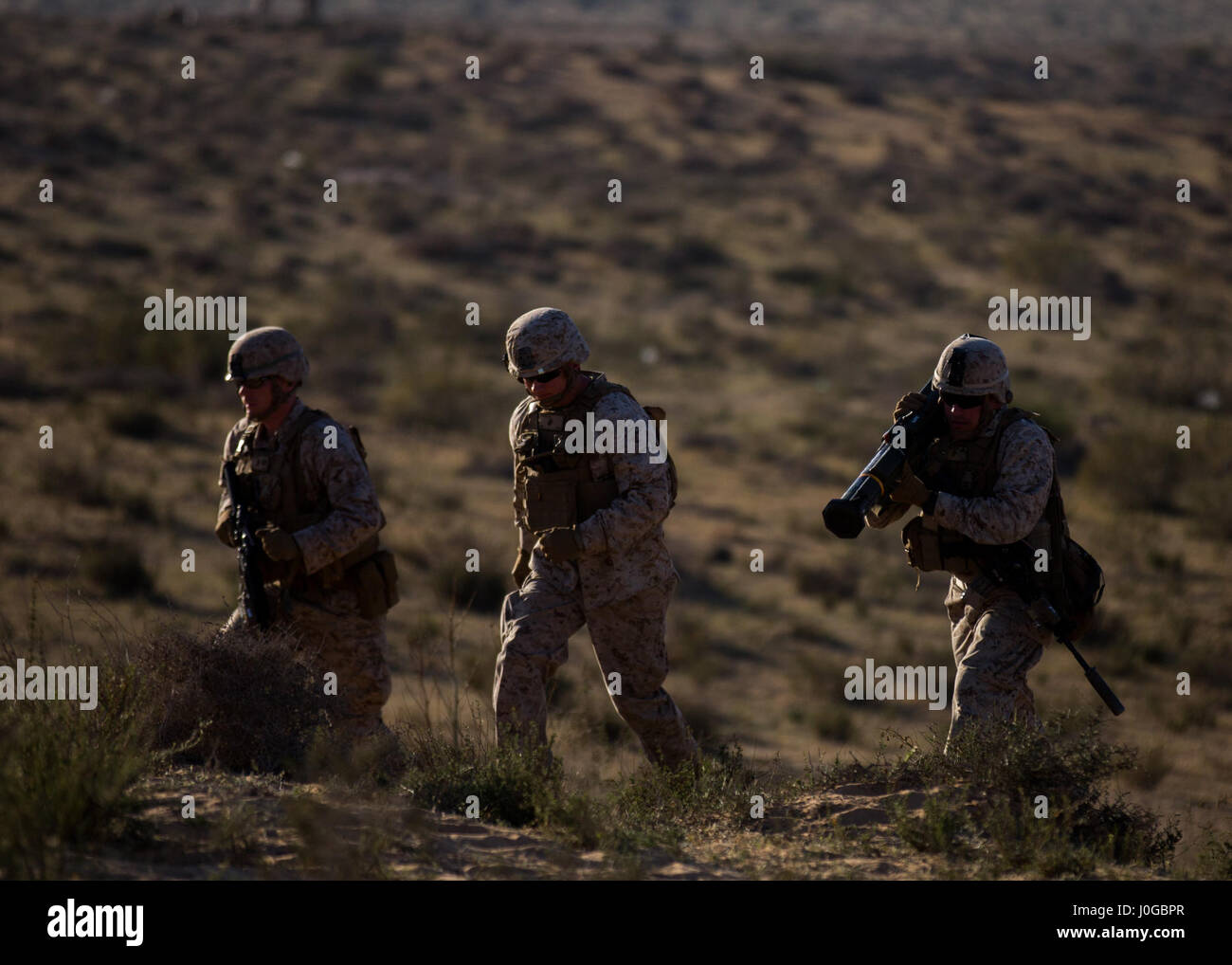 U.S. Marines with Marine Rotational Force Europe 17.1 run with an ...