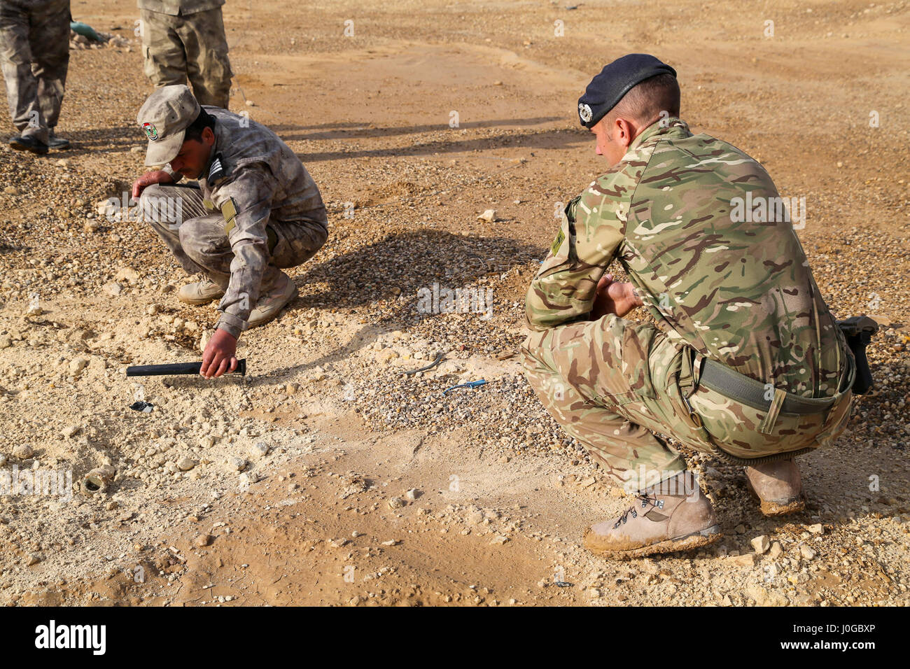 An Iraqi security forces soldier scans for hidden improvised explosive ...