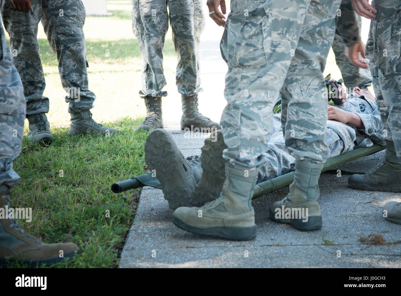 Members of the 403rd Security Forces Squadron practice a litter carry ...