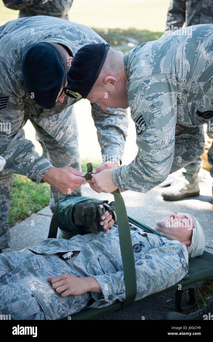 Members of the 403rd Security Forces Squadron practice a litter carry ...