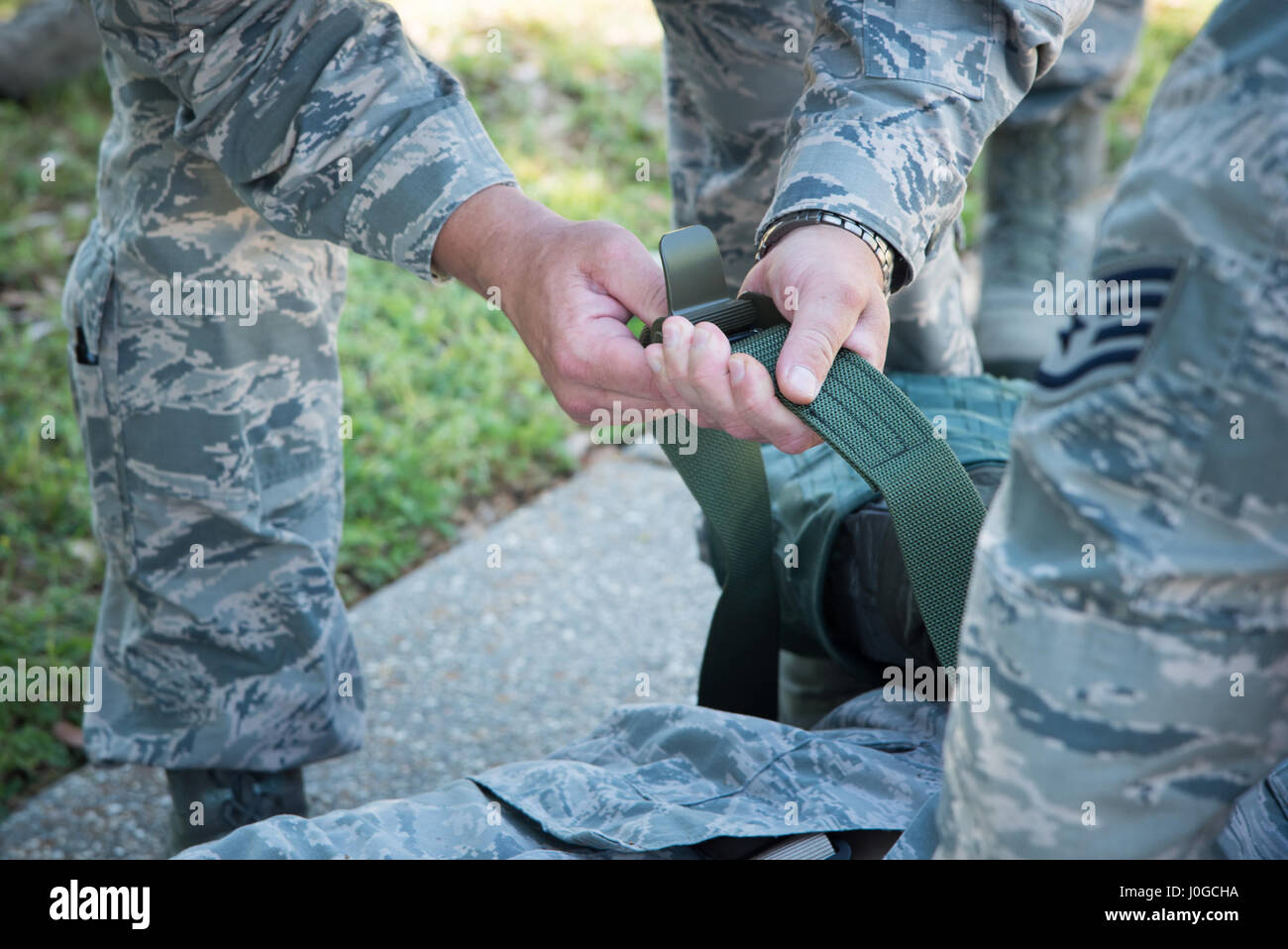 Members of the 403rd Security Forces Squadron practice a litter carry ...