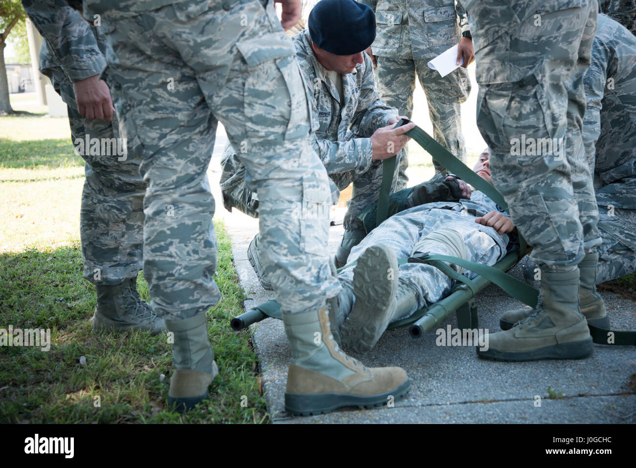 Members of the 403rd Security Forces Squadron practice a litter carry ...
