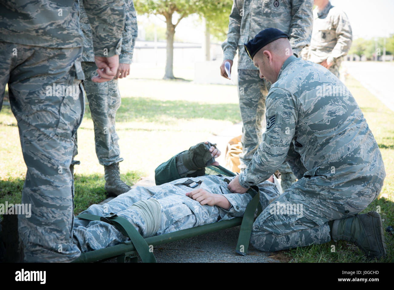 Members of the 403rd Security Forces Squadron practice a litter carry ...