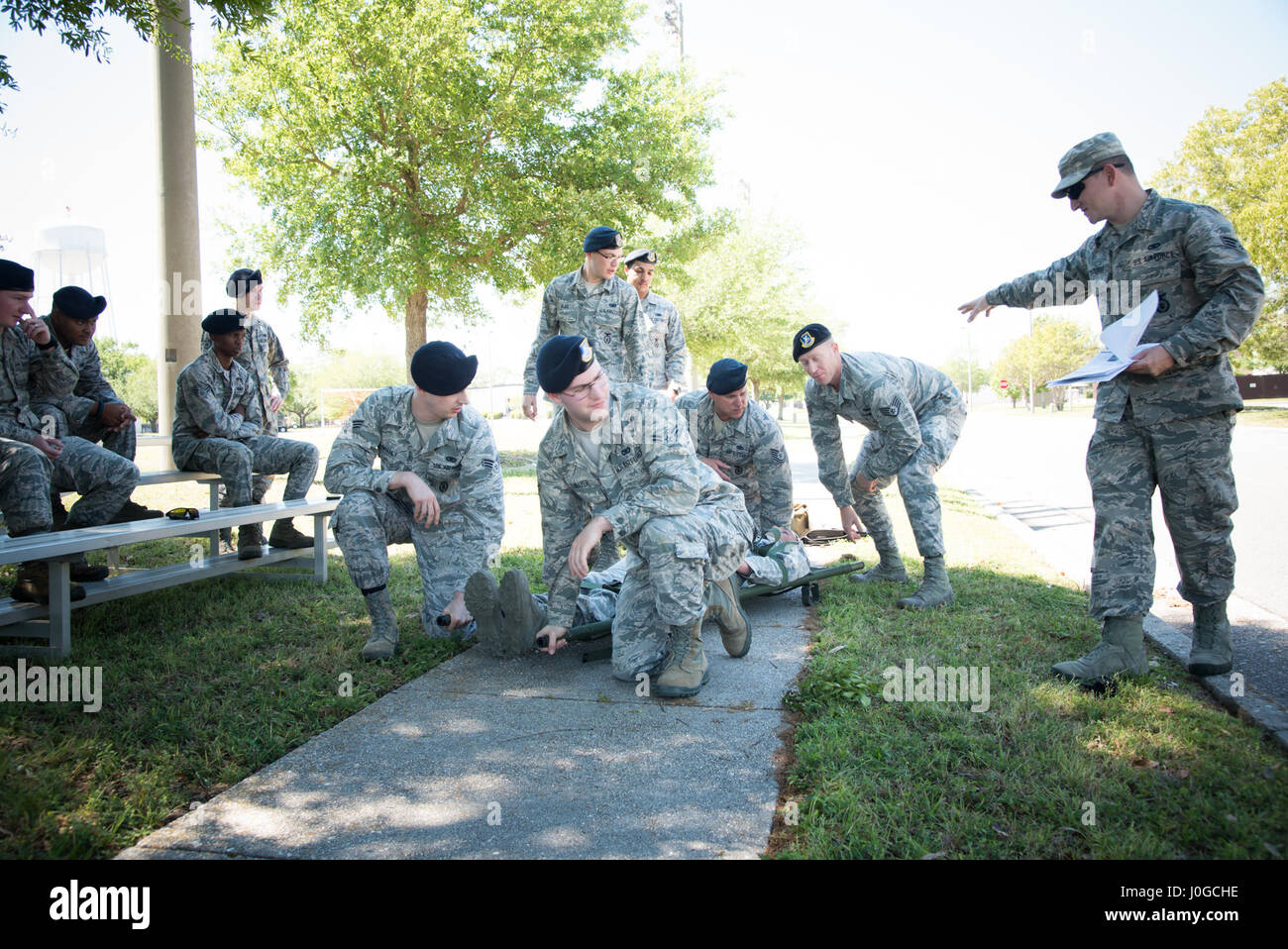 Members of the 403rd Security Forces Squadron practice a litter carry ...