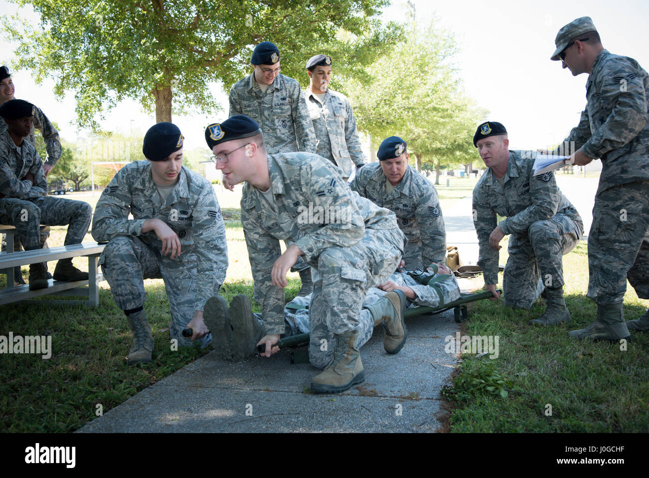 Members of the 403rd Security Forces Squadron practice a litter carry ...