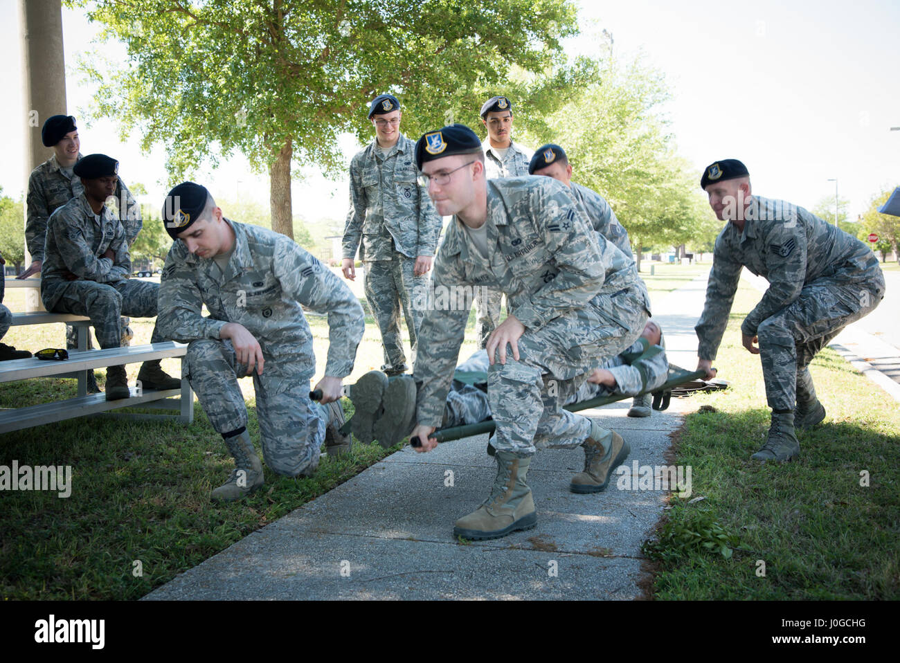 Members of the 403rd Security Forces Squadron practice a litter carry ...