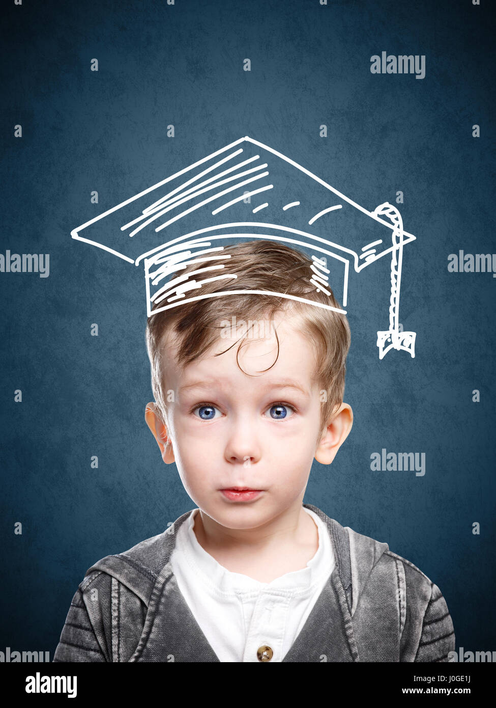 Smart child in a drawn student hat Stock Photo - Alamy