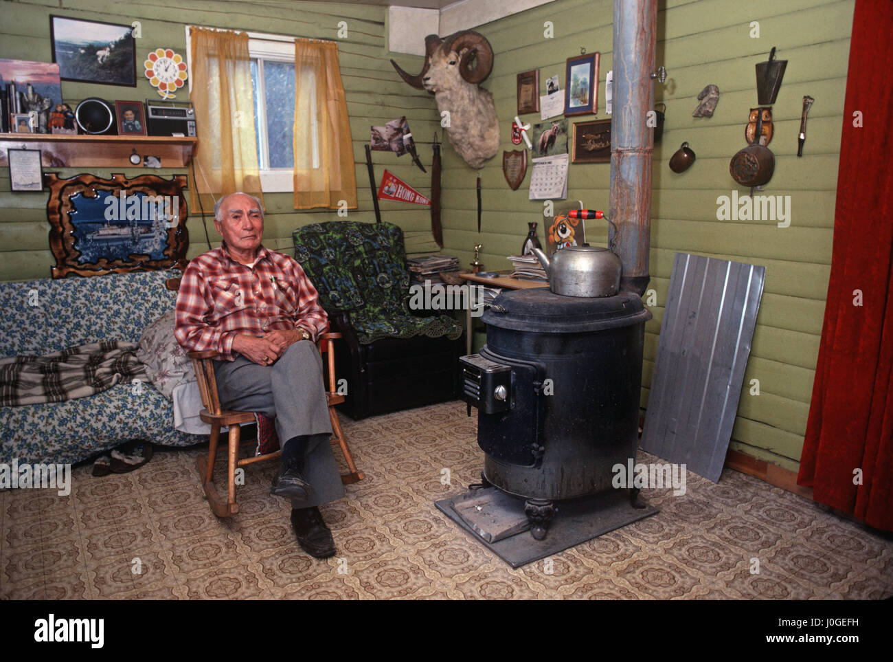 Johnny Johns, Indian trapper, Tagish First Nation elder in his home ...