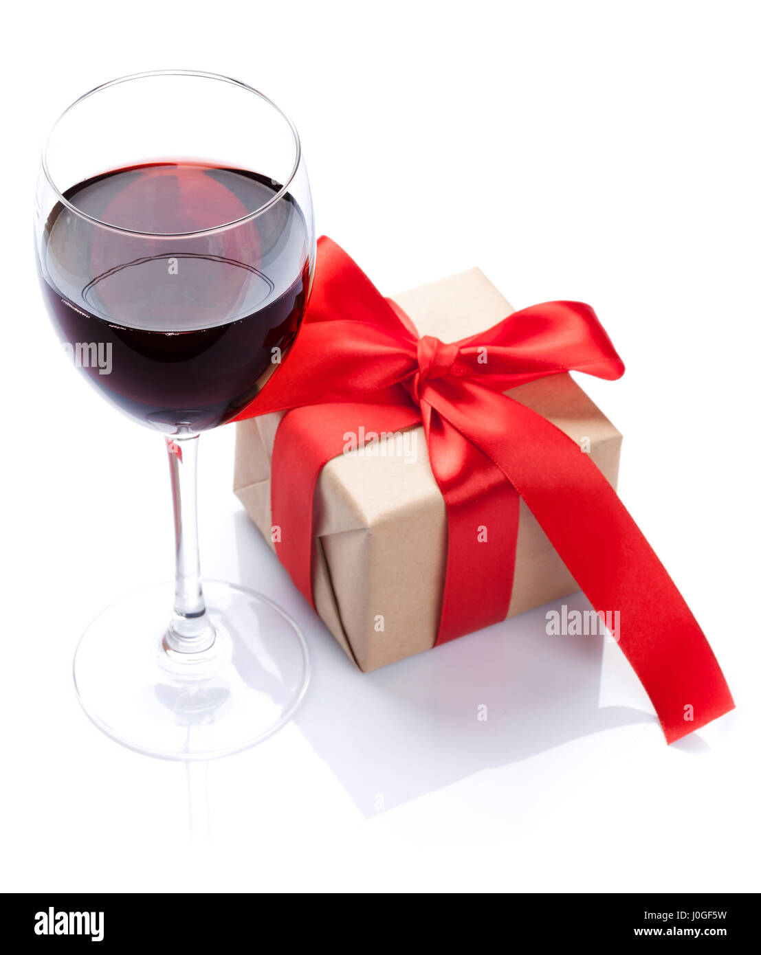 Red wine glass and gift box. Isolated on white background Stock Photo ...