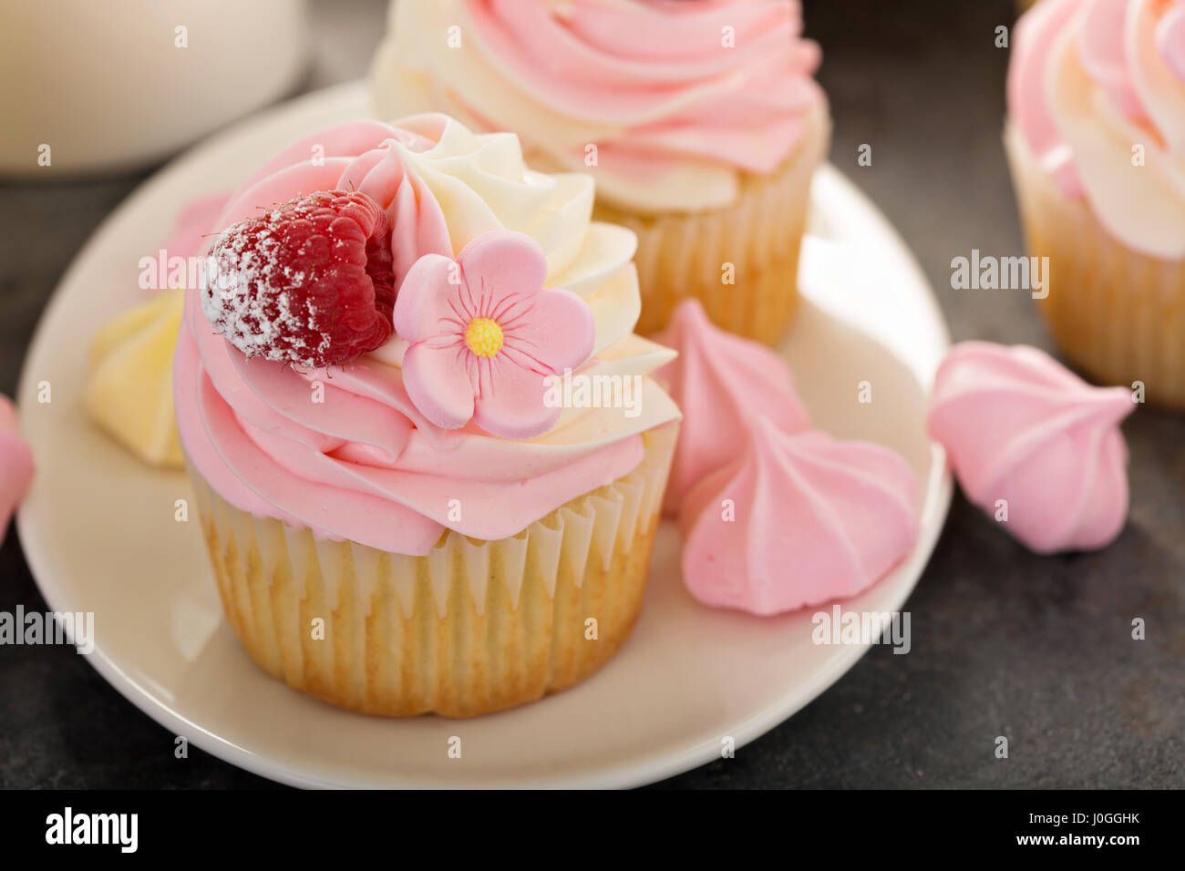 Pink vanilla and raspberry cupcakes Stock Photo - Alamy