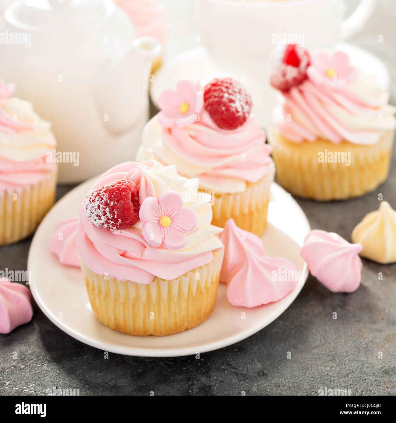 Pink vanilla and raspberry cupcakes Stock Photo - Alamy