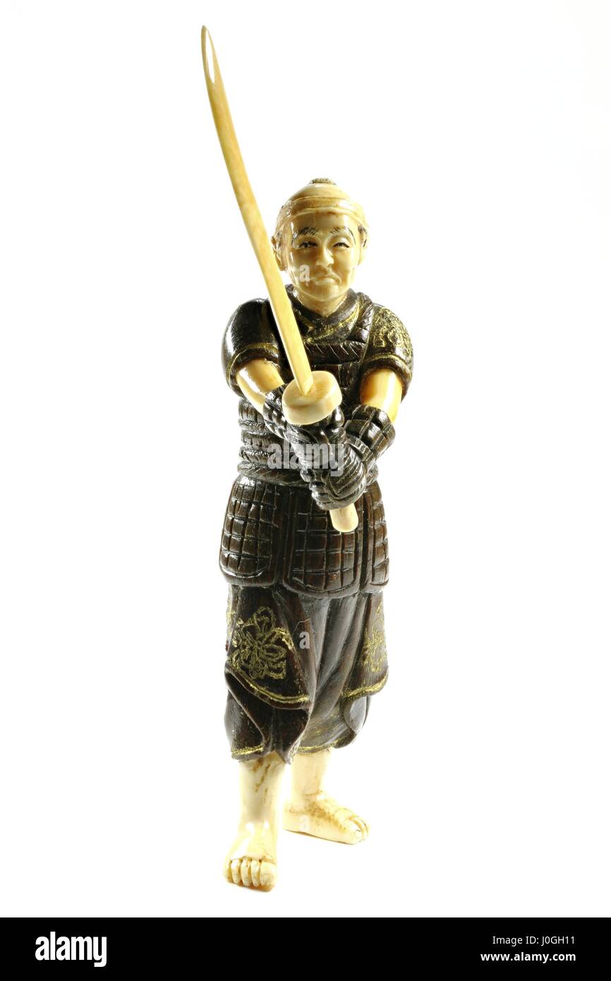 antique Japanese netsuke warrior made of ivory and boxwood isolated on ...