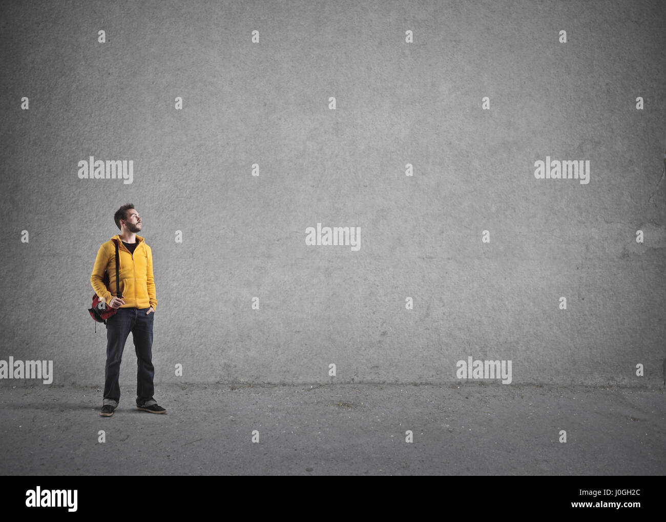 Man standing in empty room Stock Photo - Alamy