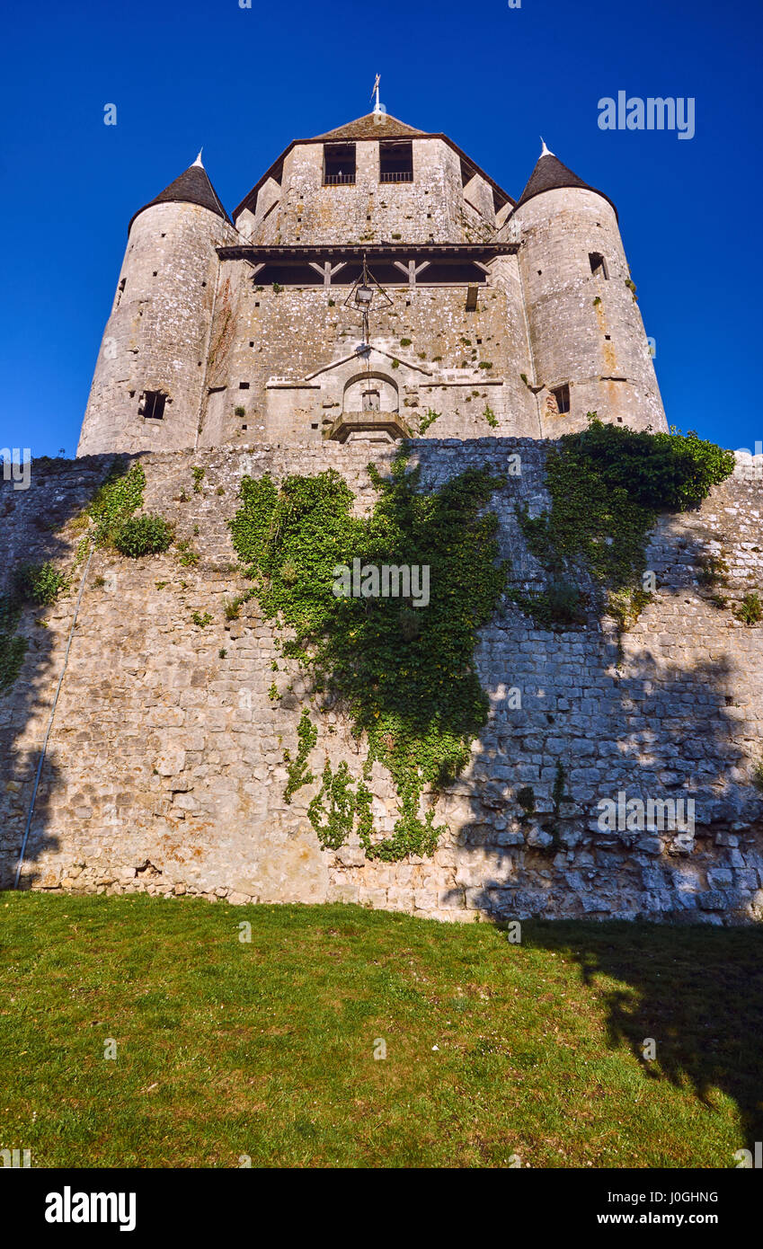 Stone walls and towers of a medieval castle in the town of Provins ...