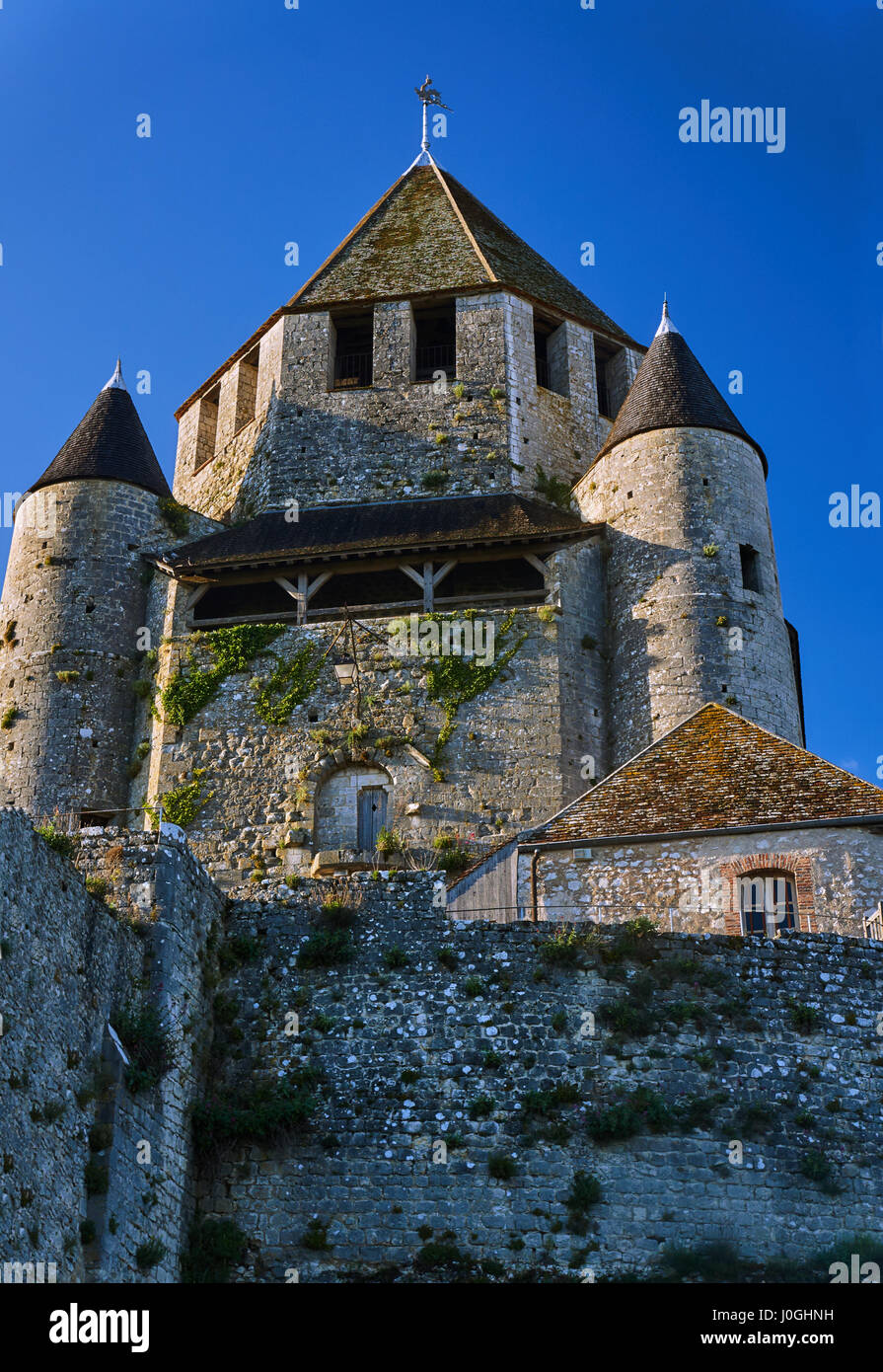 Stone walls and towers of a medieval castle in the town of Provins ...