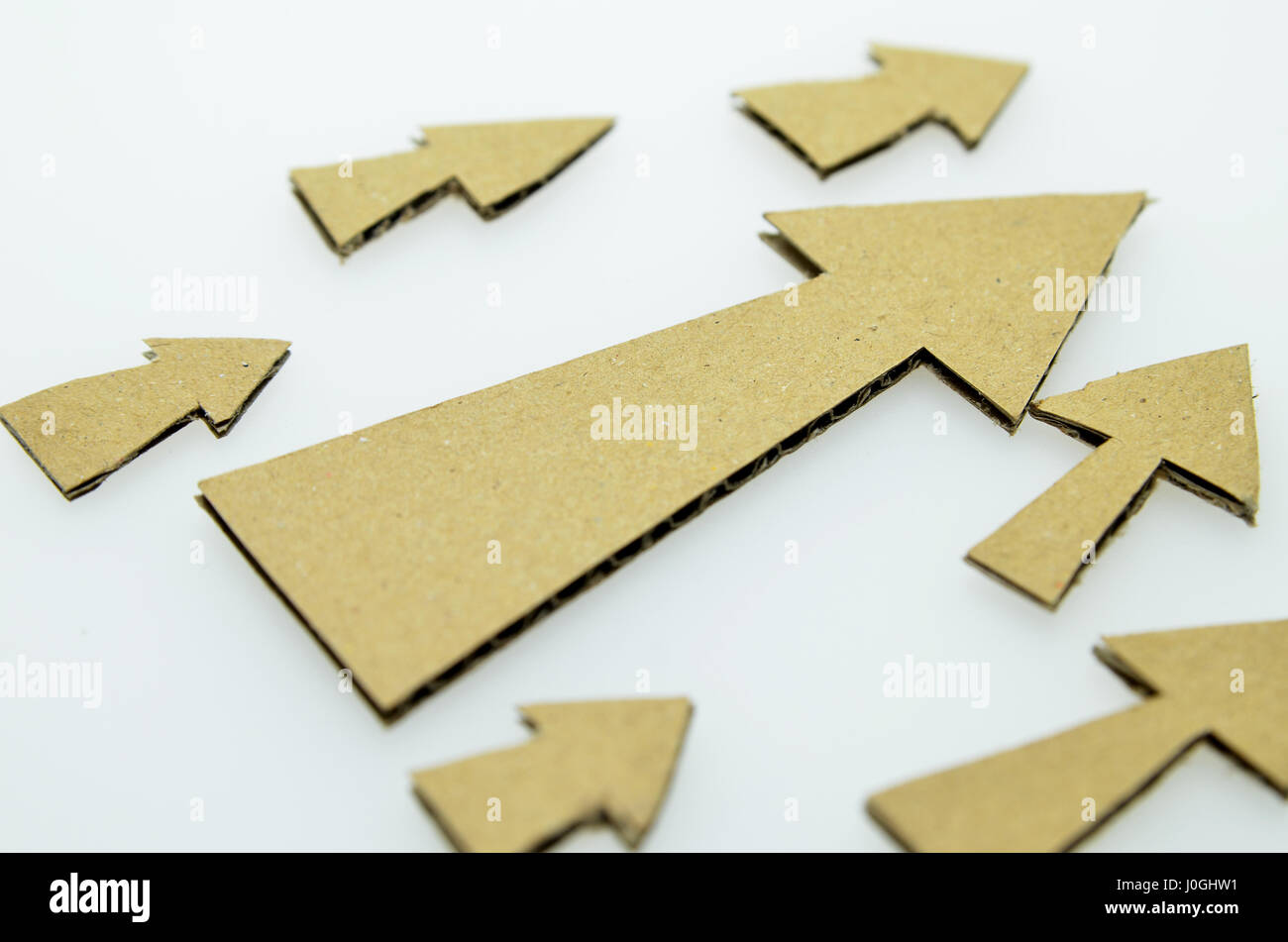 Leading arrow with other arrows on white background Stock Photo - Alamy